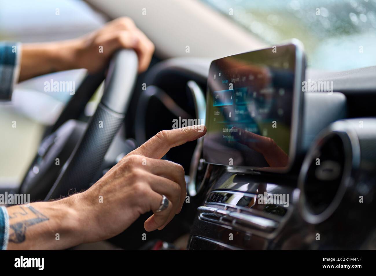 Man traveler sitting in car using gps navigation on monitor while ...