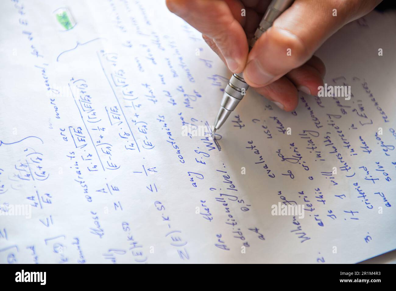 Student writing mathematical calculations on paper, closeup Stock Photo ...