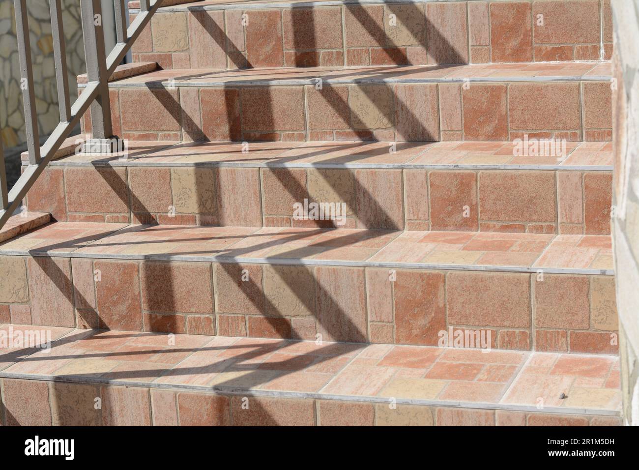 Beautiful tiled stairs with metal railings outdoors Stock Photo - Alamy