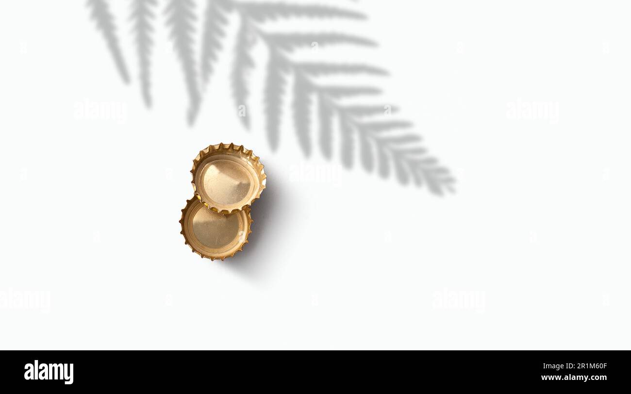 Gold beer bottle caps on a white background .beer fiesta concept Stock ...