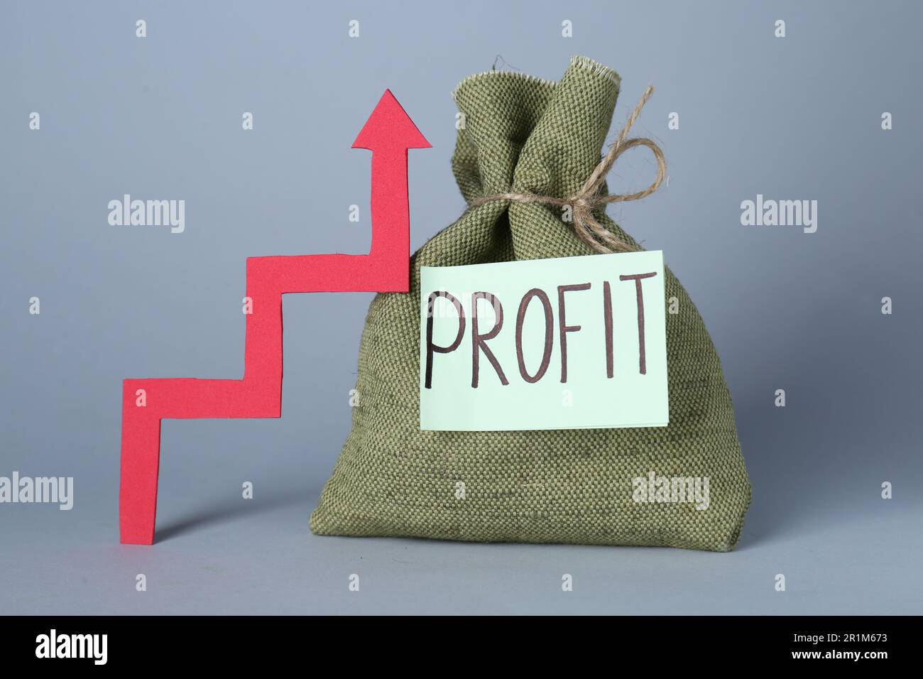 Economic profit. Money bag and arrow on light grey background Stock ...