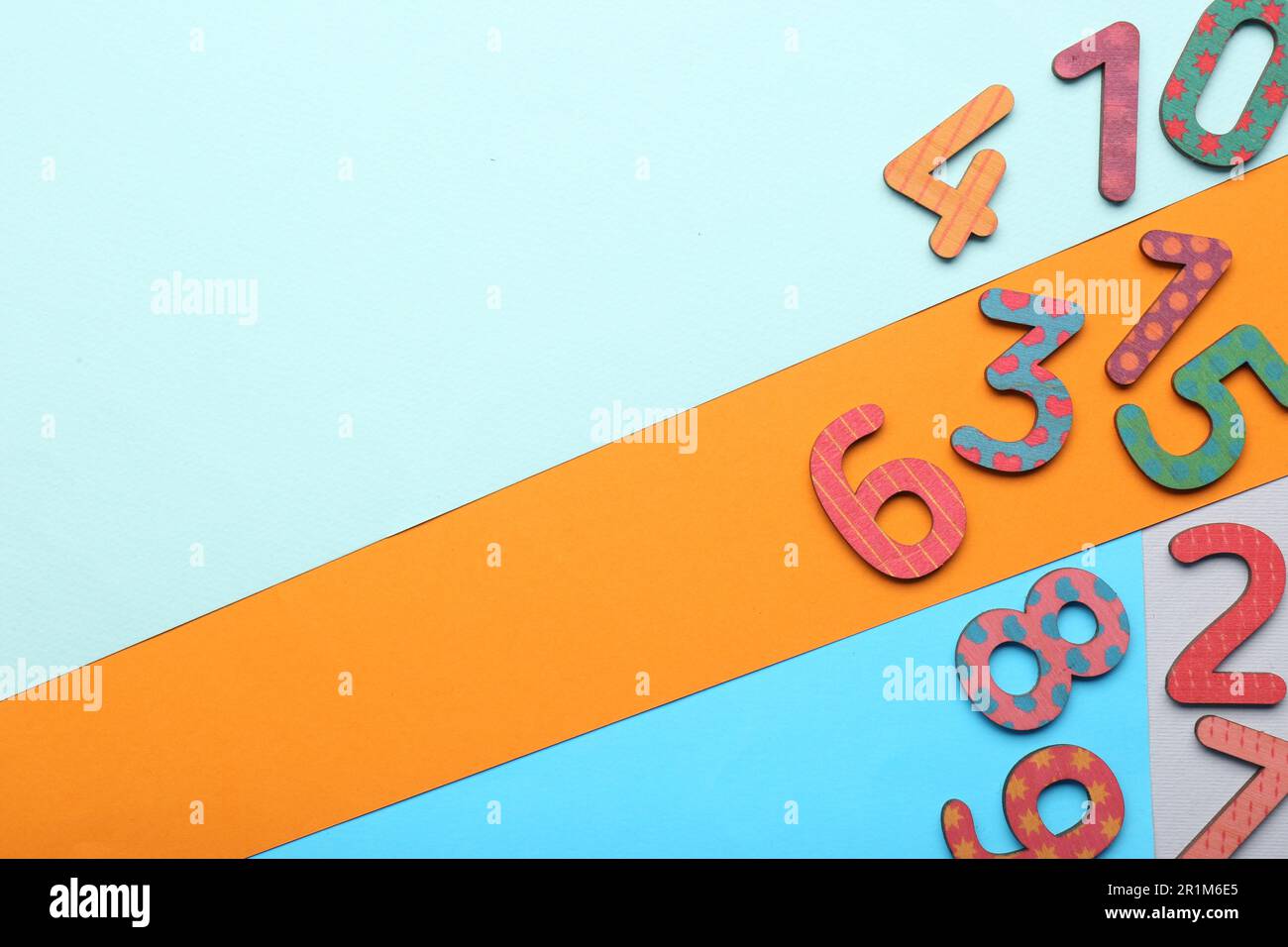 Wooden numbers on colorful background, flat lay. Space for text Stock ...