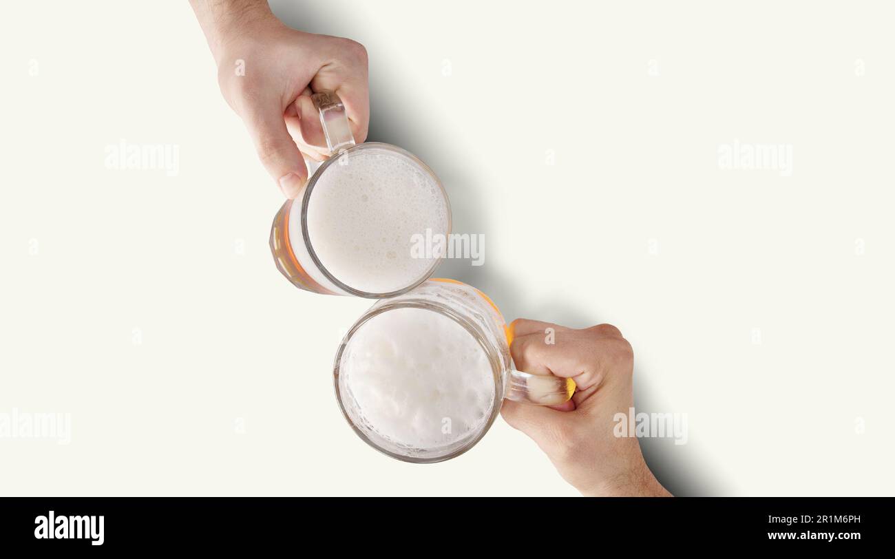 Two hands toasting refreshing cold beer Stock Photo - Alamy Two hands toasting refreshing cold beer Stock Photo - Alamy