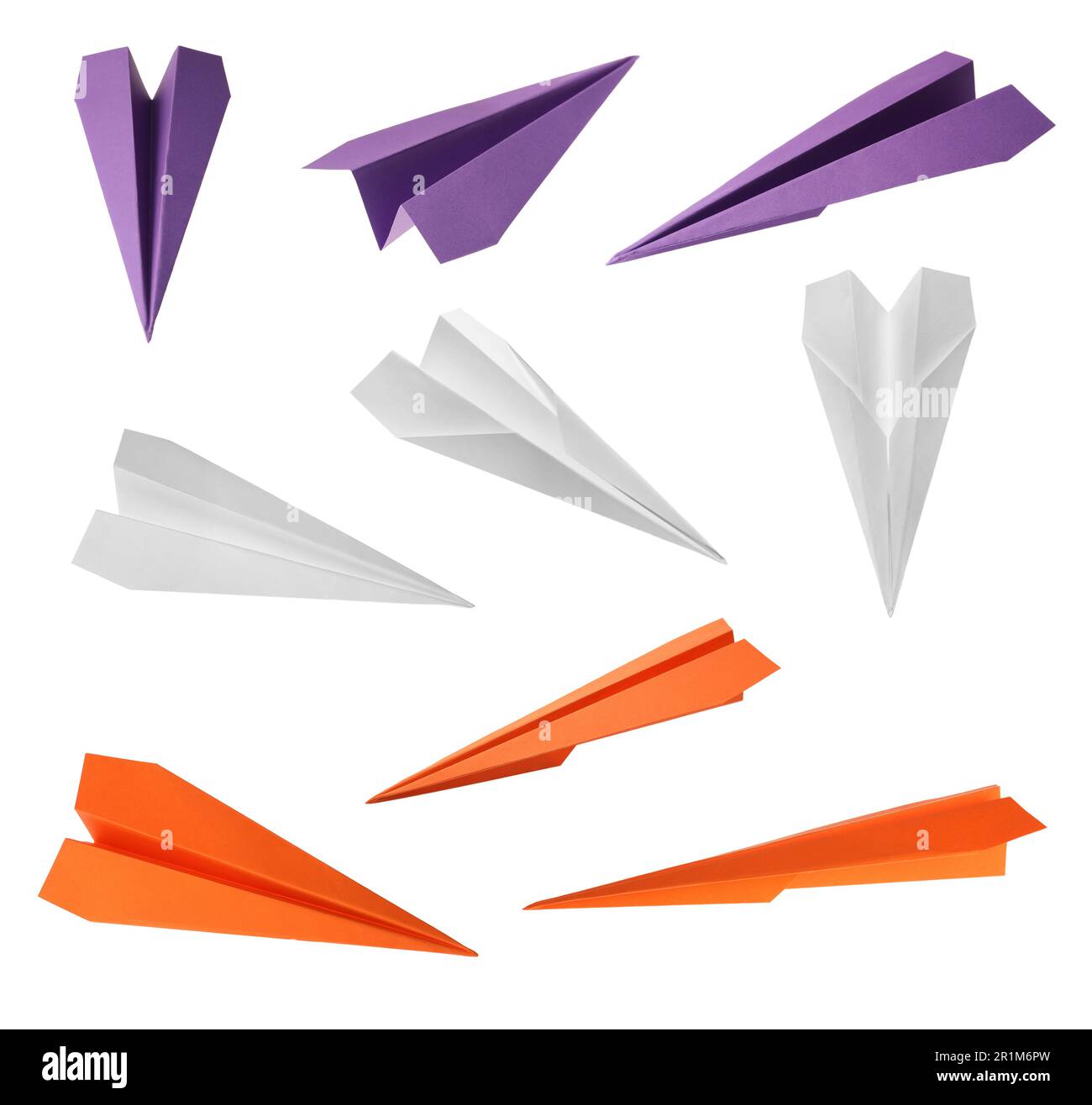 Set with handmade different color paper planes on white background ...