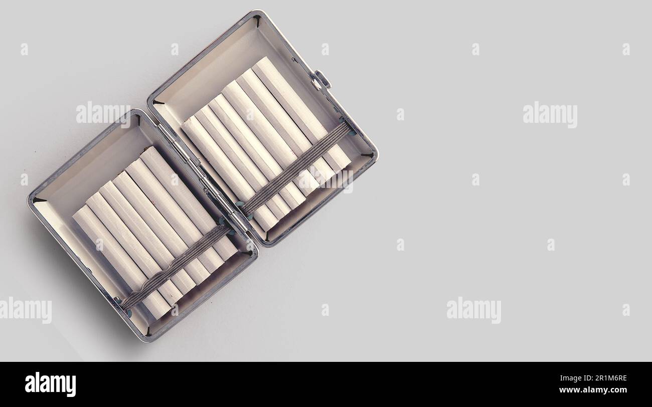 Fresh tobacco and handmade cigarettes on old metallic box Stock Photo ...