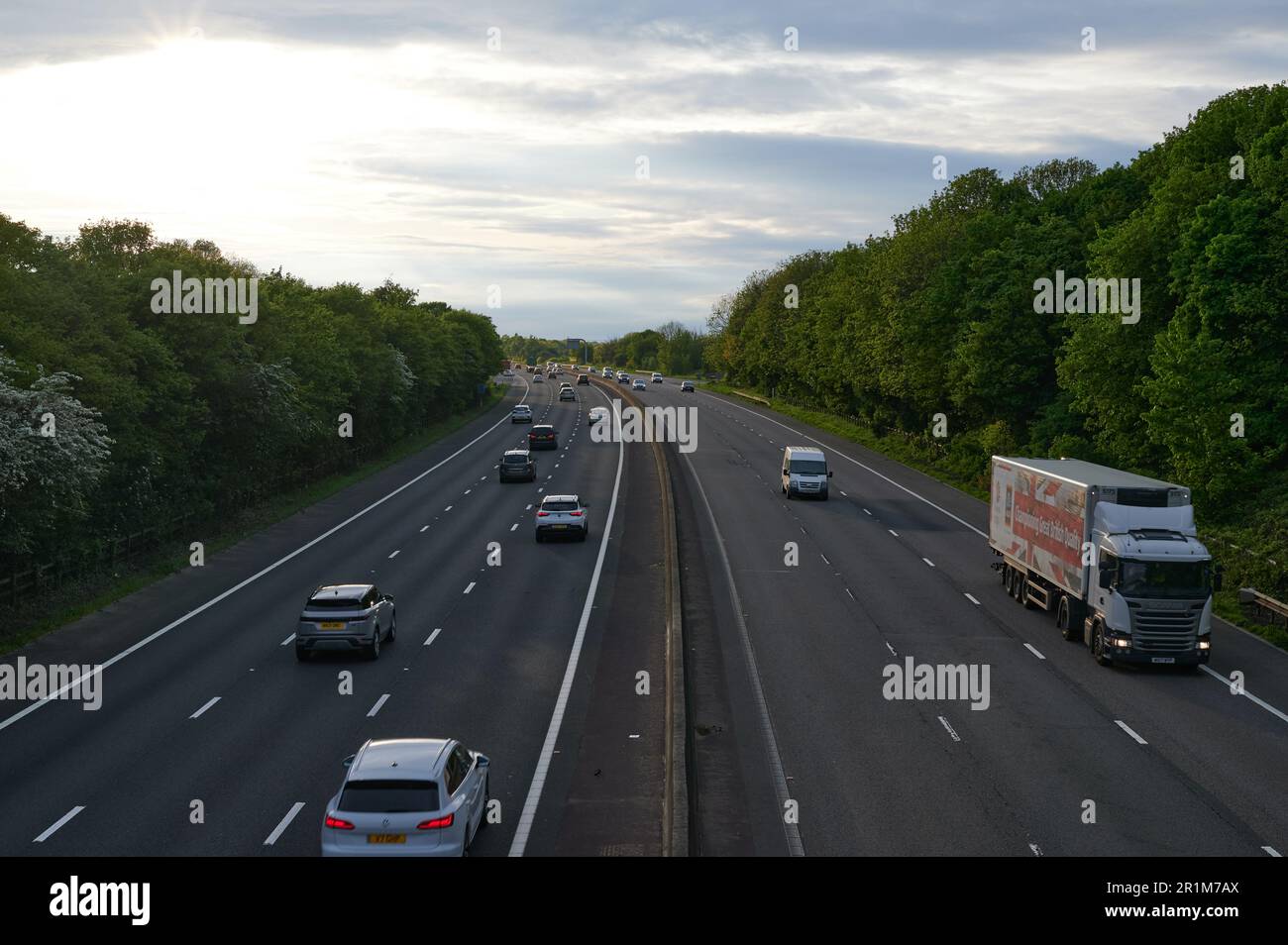 overhead image of three lane motorway in daylight with motion blur of ...