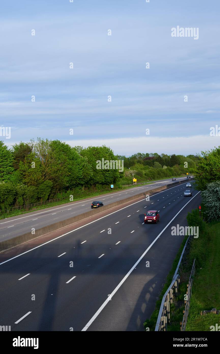overhead image of three lane motorway in daylight with motion blur of ...