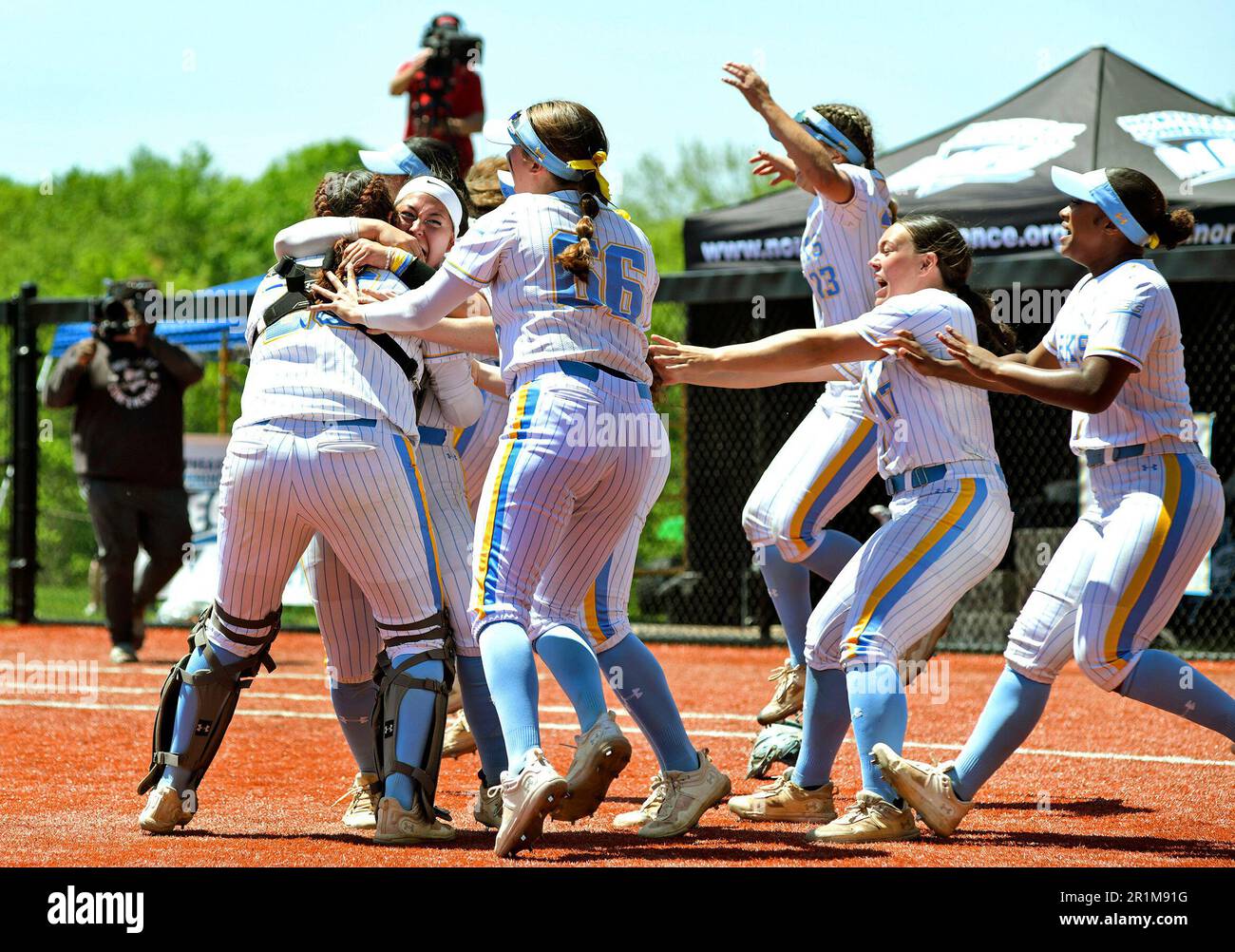 Members of the Long Island University softball team celebrate their ...