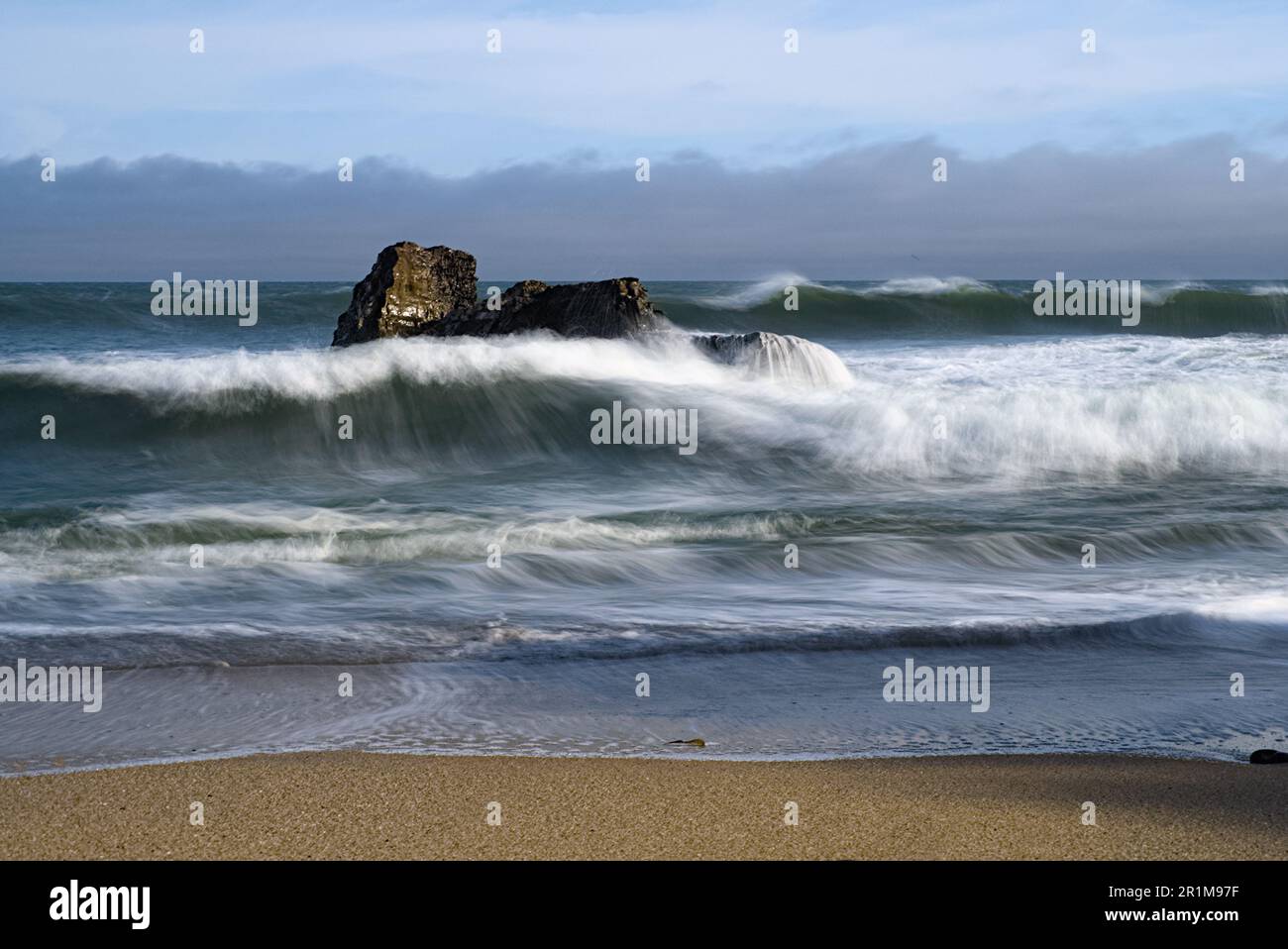 Coastal rocks and waves at the beach Stock Photo - Alamy
