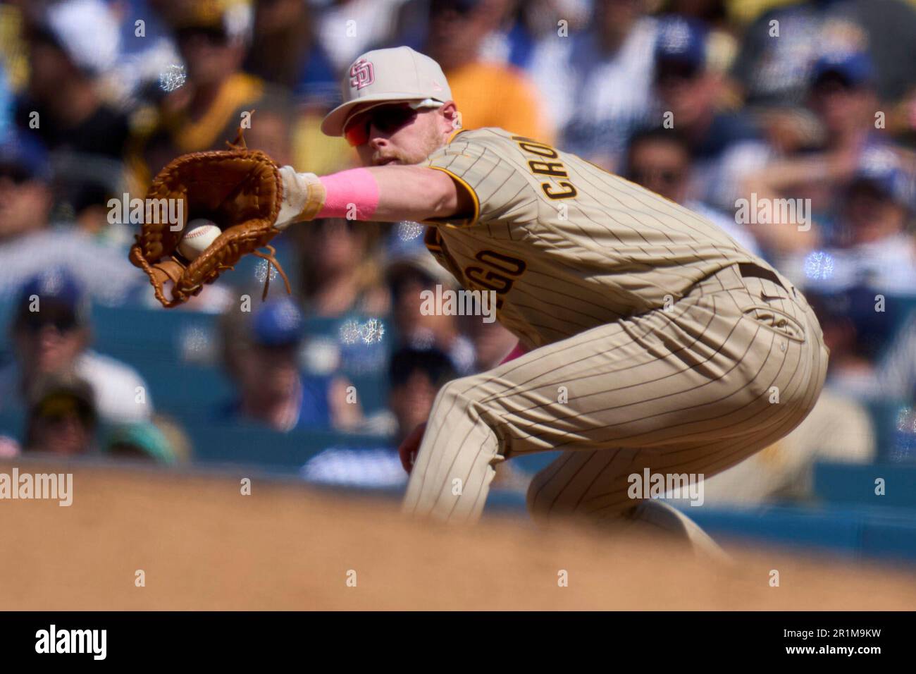 San Diego Padres first baseman Jake Cronenworth gets a throw for an out ...