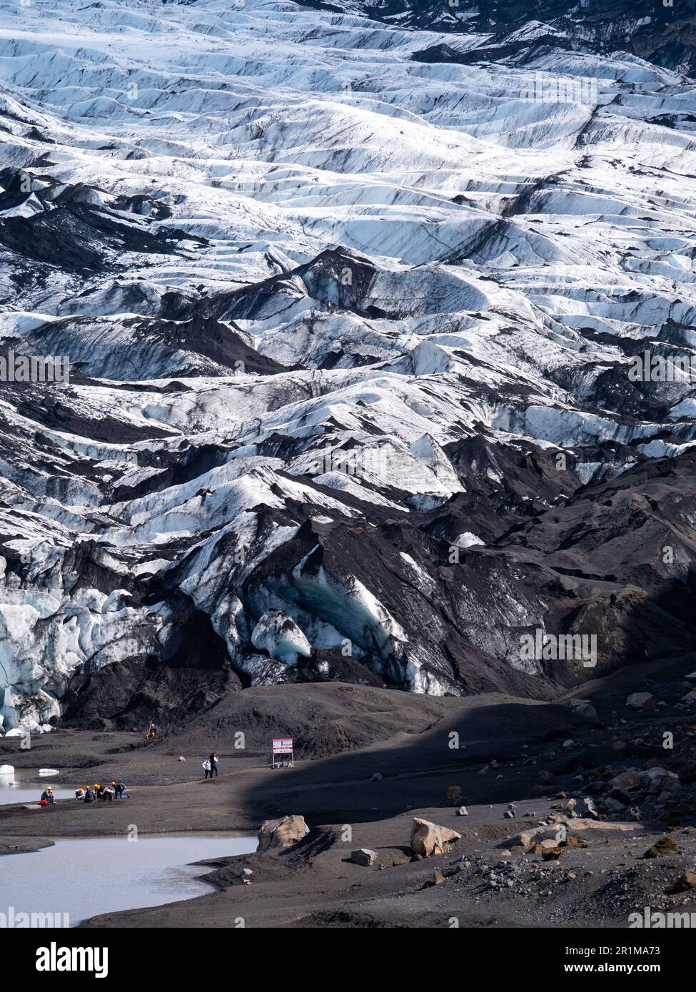 A breathtaking landscape featuring snow-capped mountains and a glacier ...