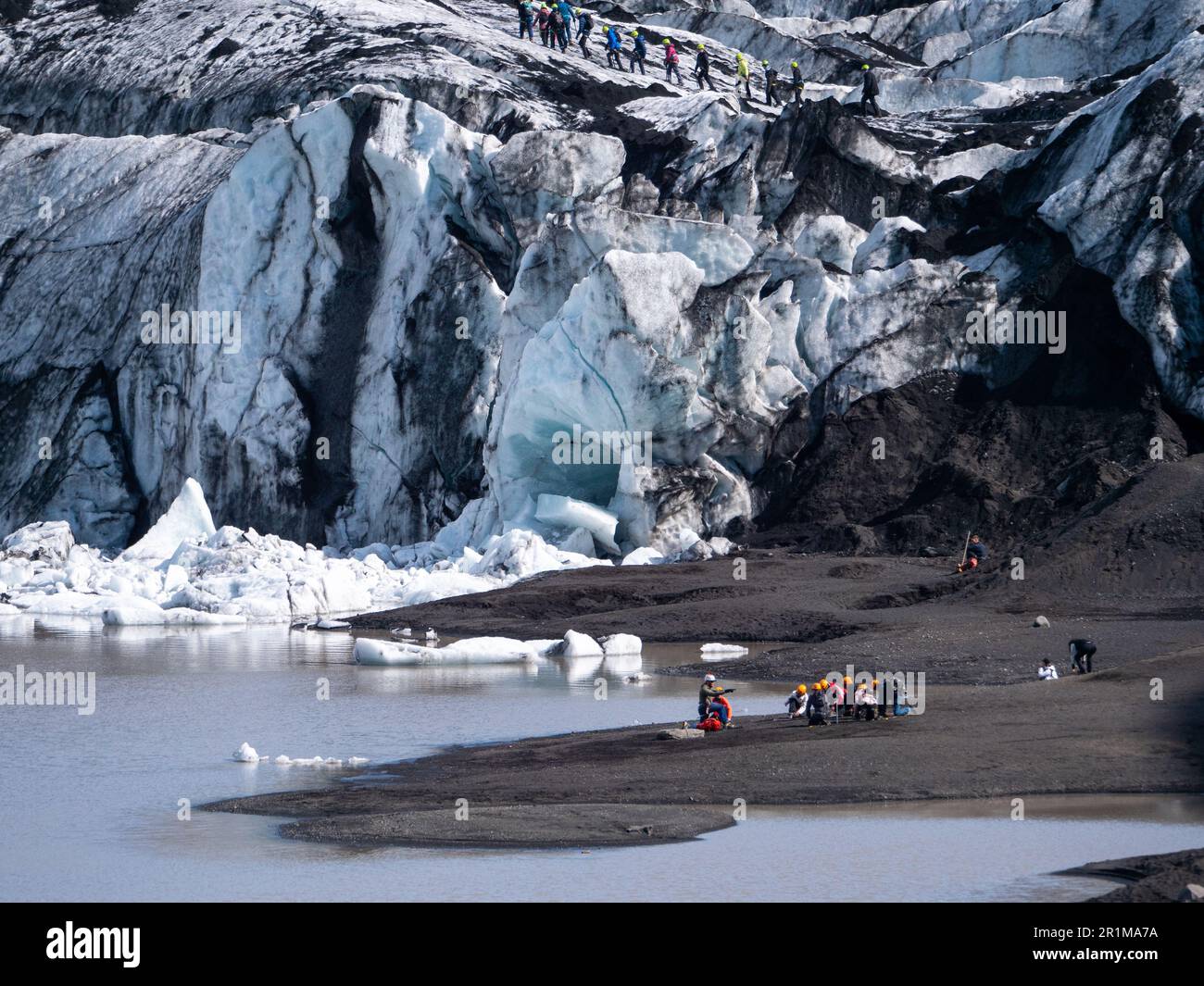 A breathtaking landscape featuring snow-capped mountains and a glacier ...