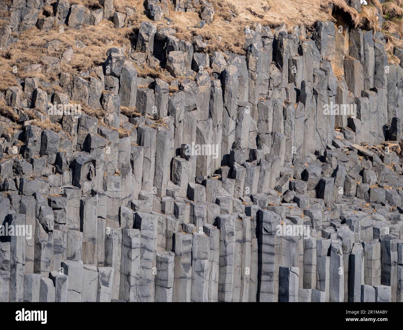 A dramatic landscape featuring natural rock formations resembling the ...