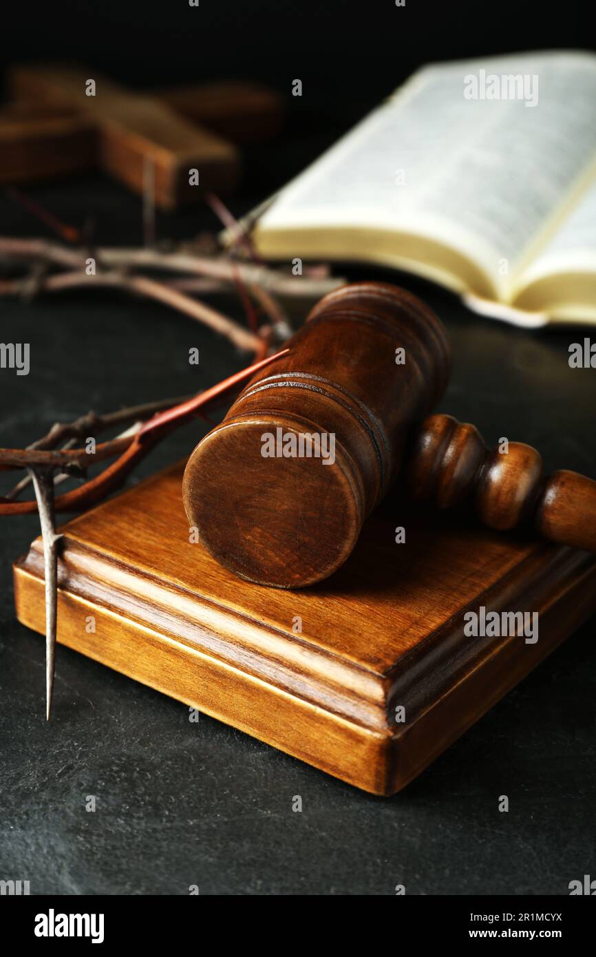 Wooden judge gavel and crown of thorns on black table, closeup Stock ...