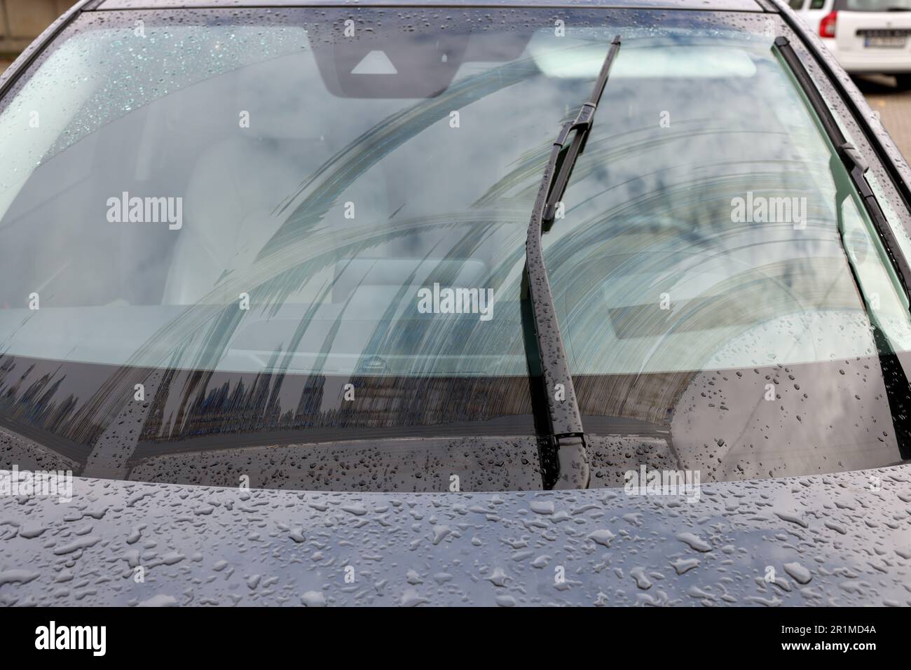 Car wipers cleaning water drops from windshield glass, closeup Stock ...