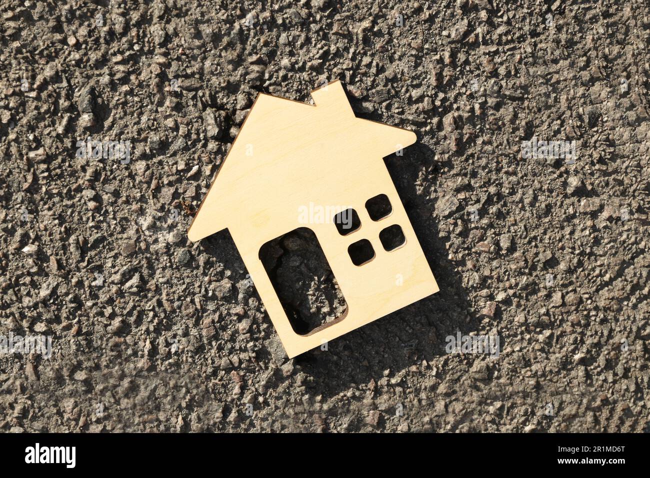 Wooden house model on cracked asphalt, top view. Earthquake disaster ...