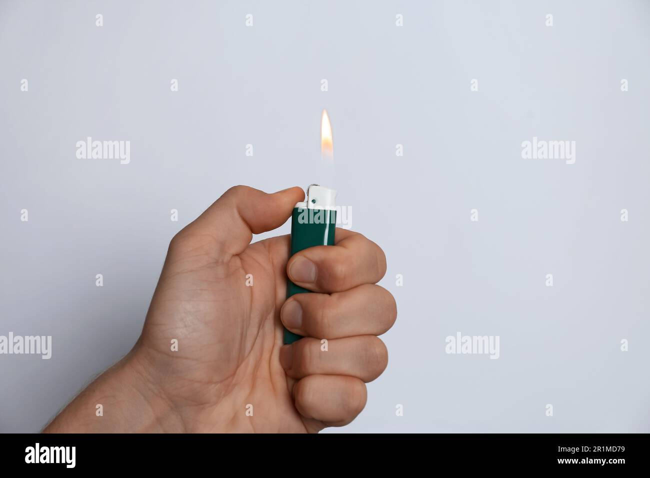 Man hand holding lighter white hi-res stock photography and images - Alamy