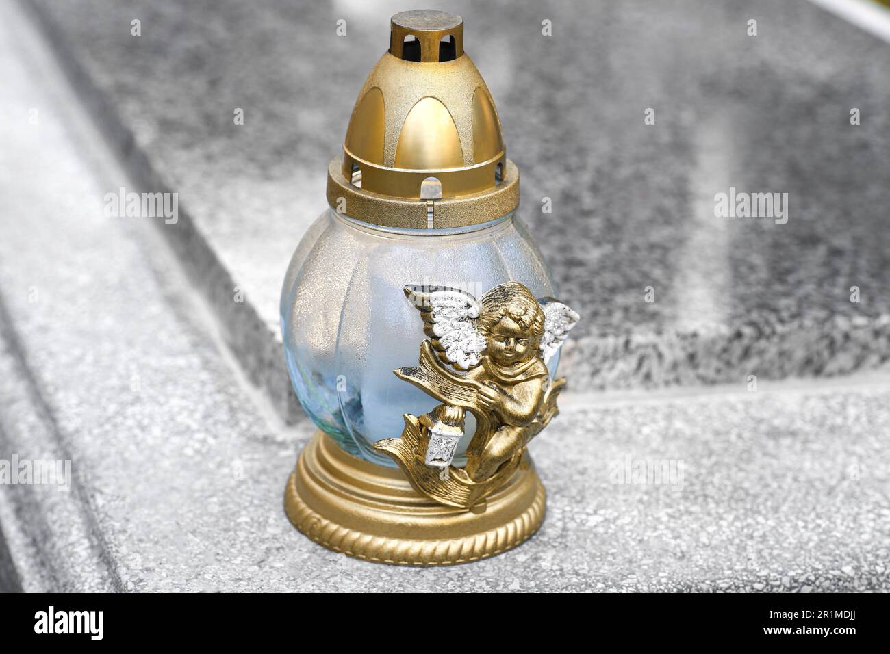 Grave lantern on granite surface in cemetery Stock Photo - Alamy