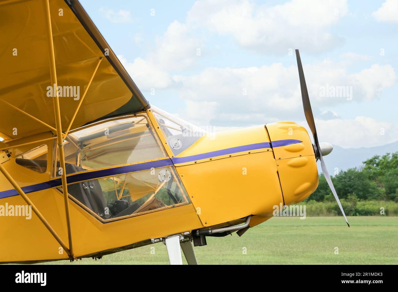 View of beautiful ultralight airplane in field on autumn day Stock ...