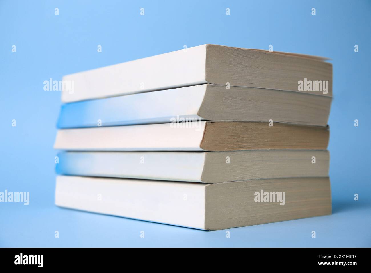 Collection of books on light blue background Stock Photo - Alamy