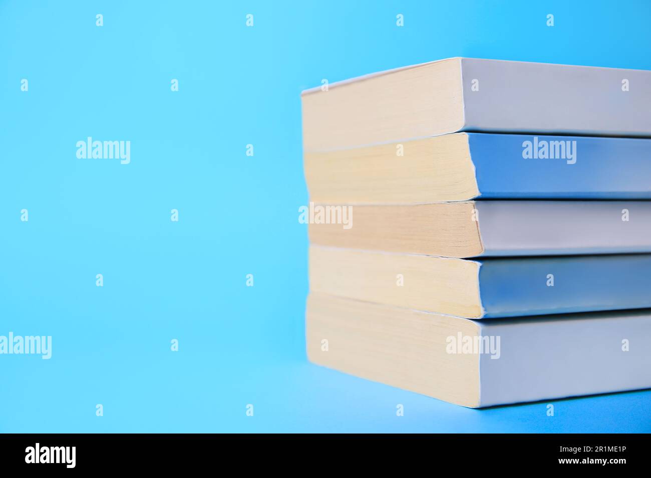 Collection of books on light blue background, space for text Stock ...