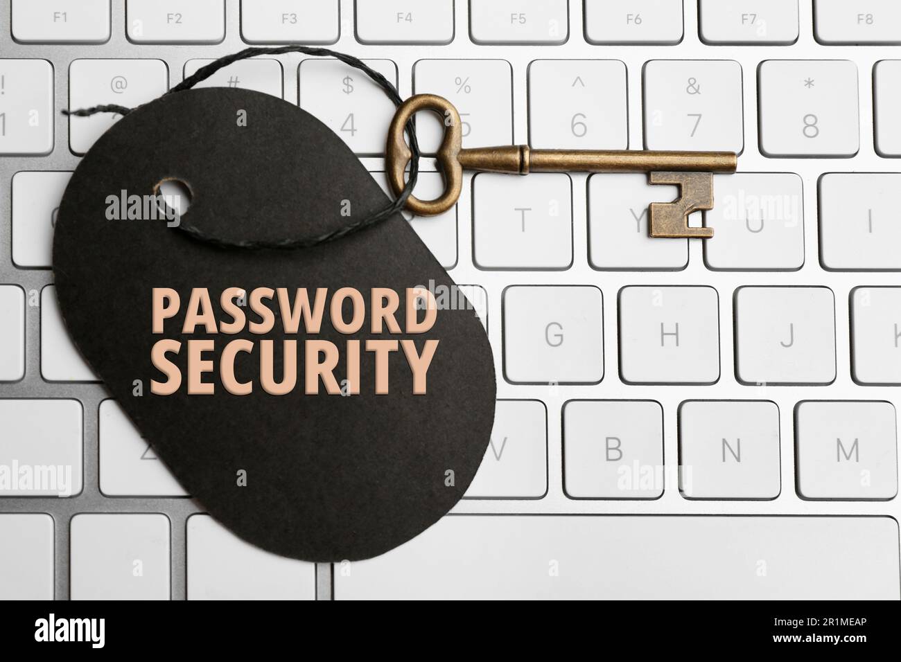 Key with tag PASSWORD SECURITY on laptop keyboard, top view Stock Photo ...