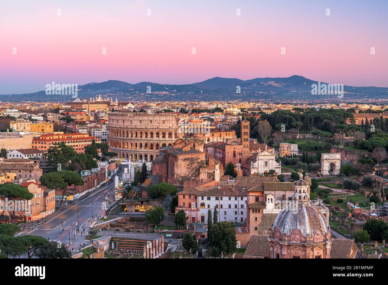Rome, Italy overlooking the Roman Forum and Colosseum at dusk Stock ...