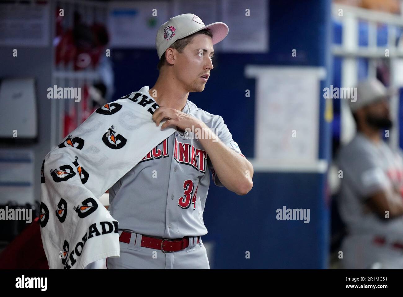 Cincinnati Reds pitcher Luke Weaver looks out of the dugout during the ...