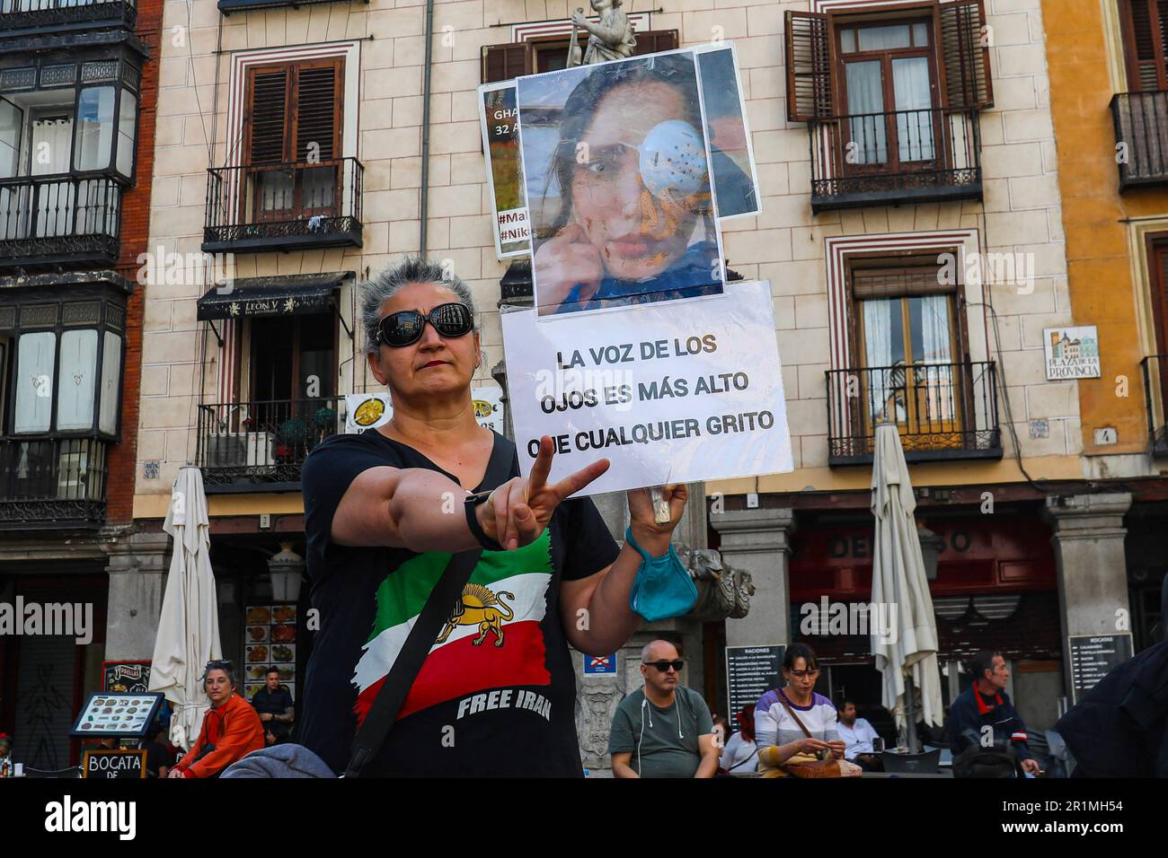 Madrid, Spain. 13th May, 2023. A woman makes a victory sign with her ...