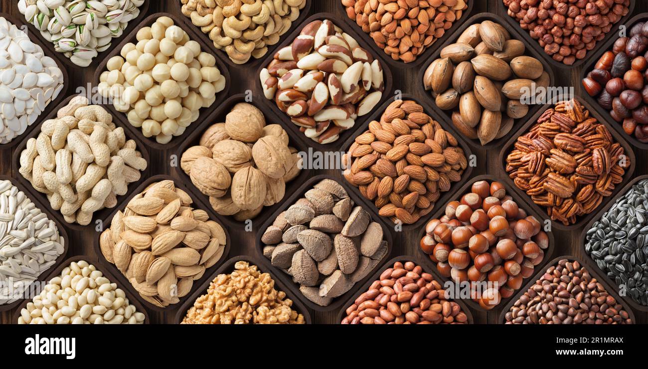 seeds and nuts background, natural food in wooden bowls, top view Stock ...