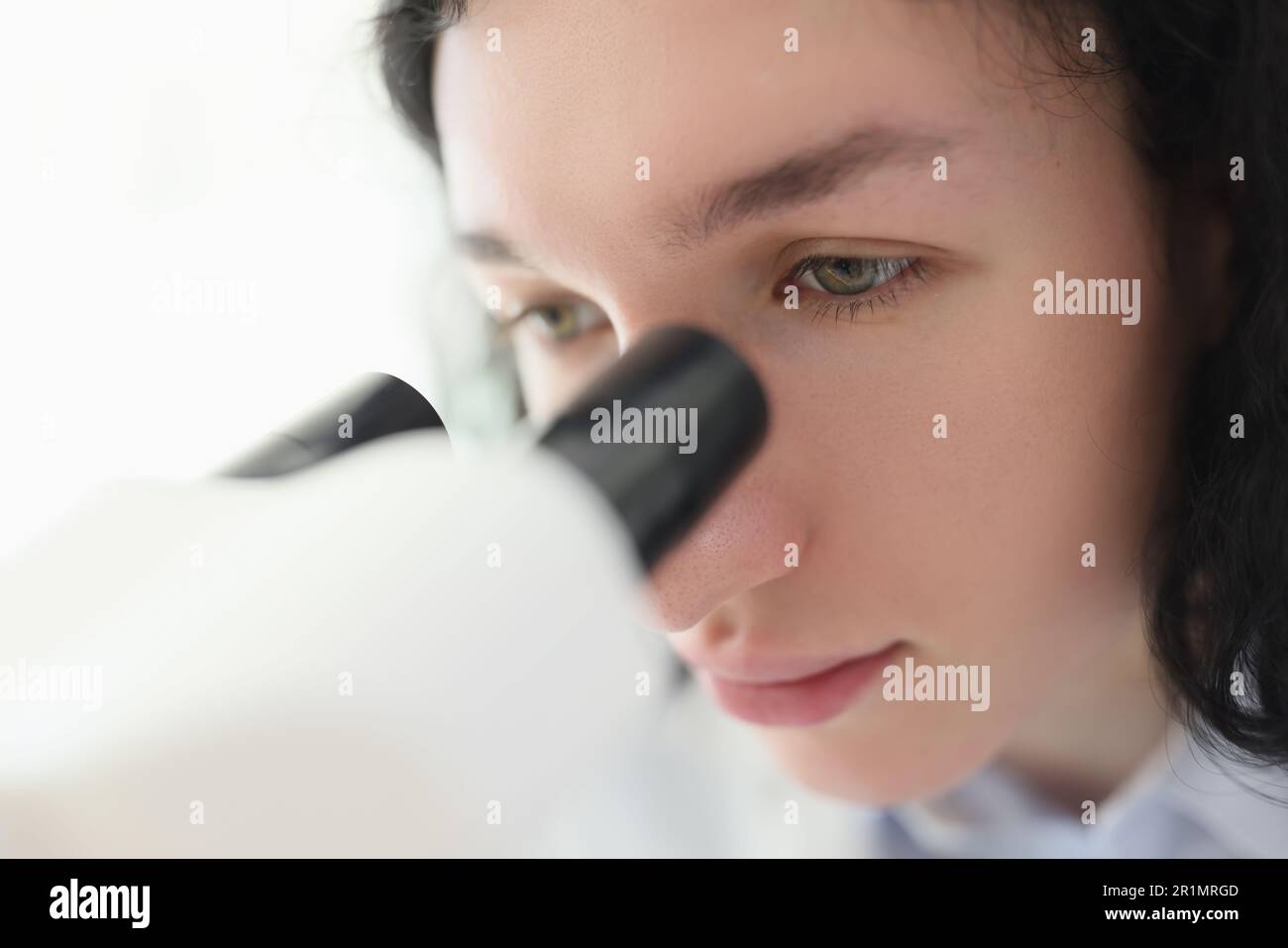 Laboratory worker checks sample using electronic microscope Stock Photo ... Laboratory worker checks sample using electronic microscope Stock Photo ...