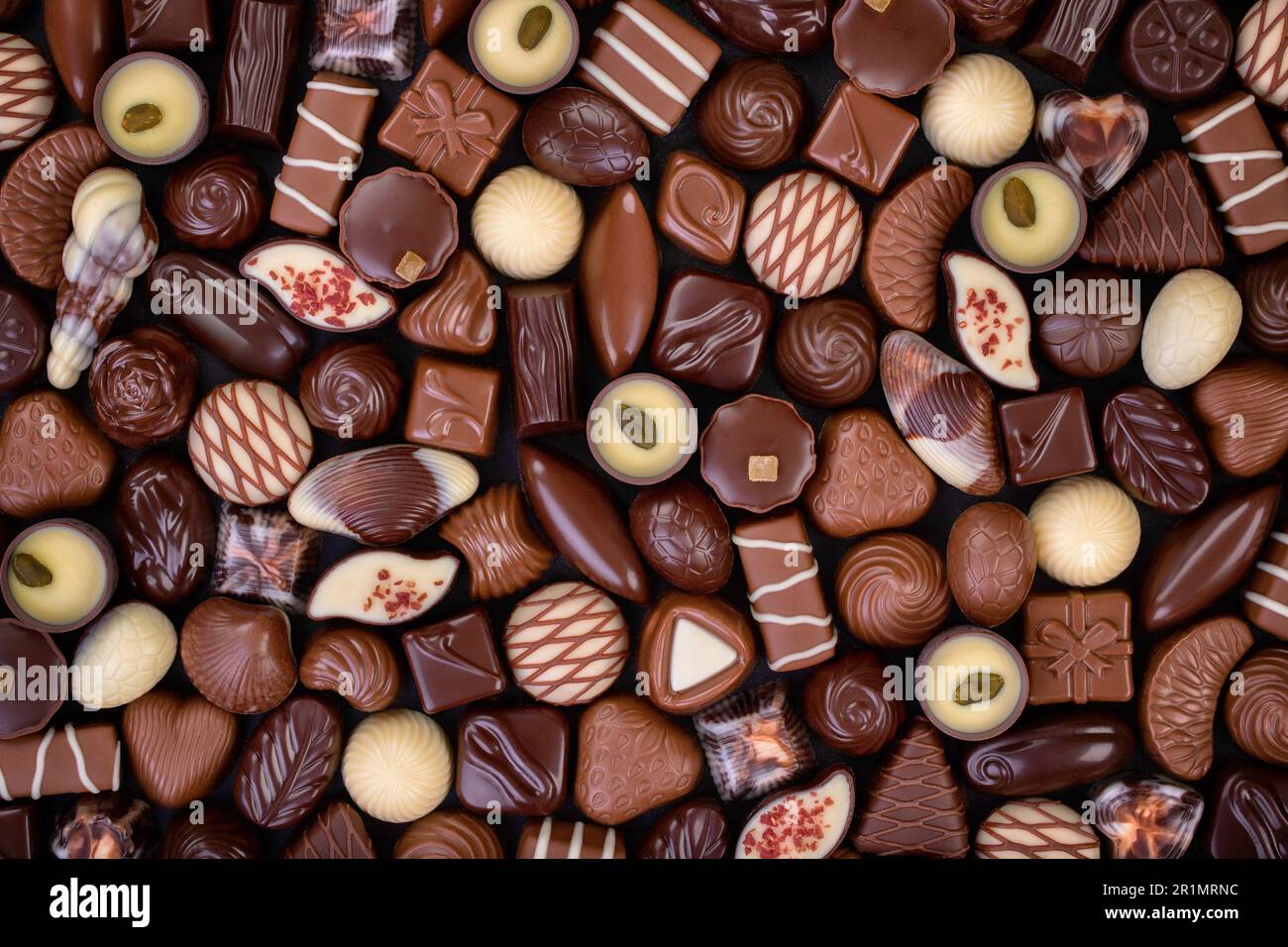 Mix chocolate candy and other confection, sweet food background Stock ...