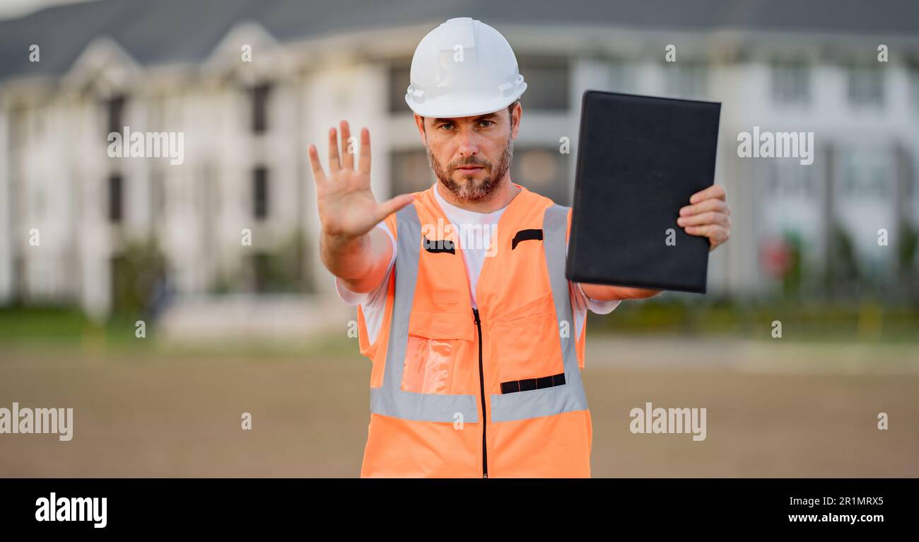 Builder with stop gesture, no hand, dangerous on building concept ...