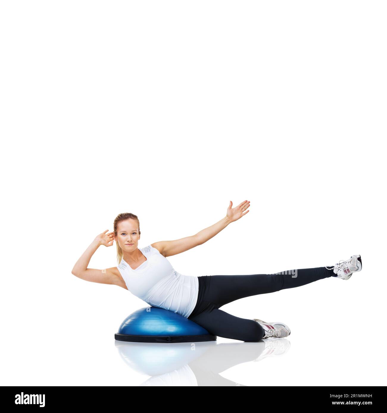 Increasing her core strength. Portrait of an attractive young woman ...