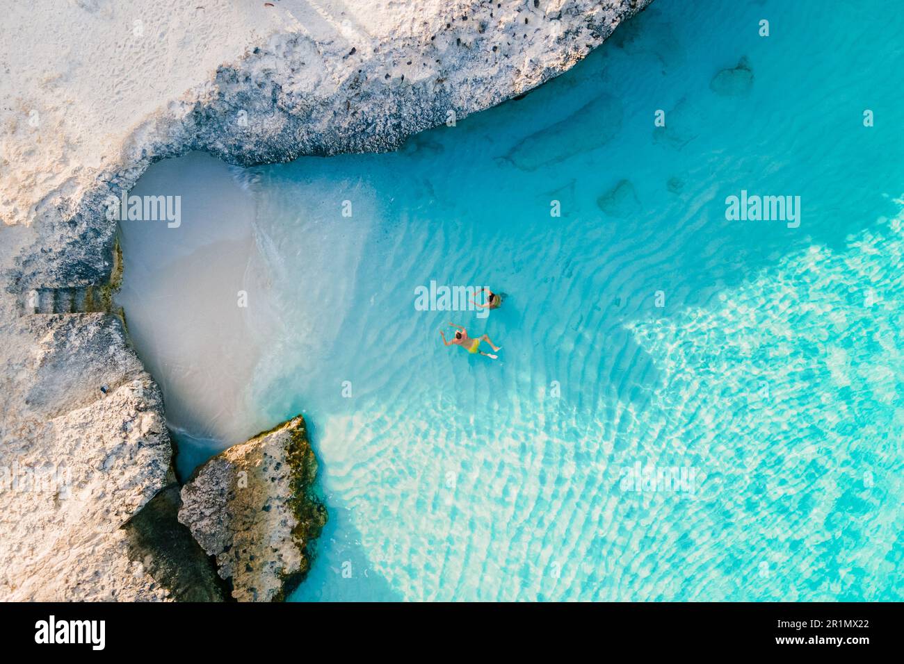 a couple of men and women on the beach of Tres Trap Aruba Caribbean ...