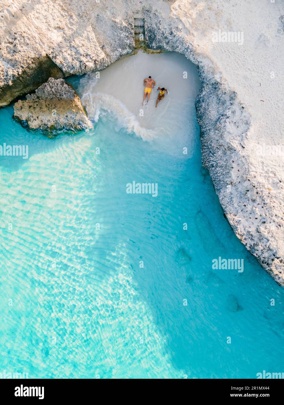a couple of men and women on the beach of Tres Trap Aruba Caribbean ...