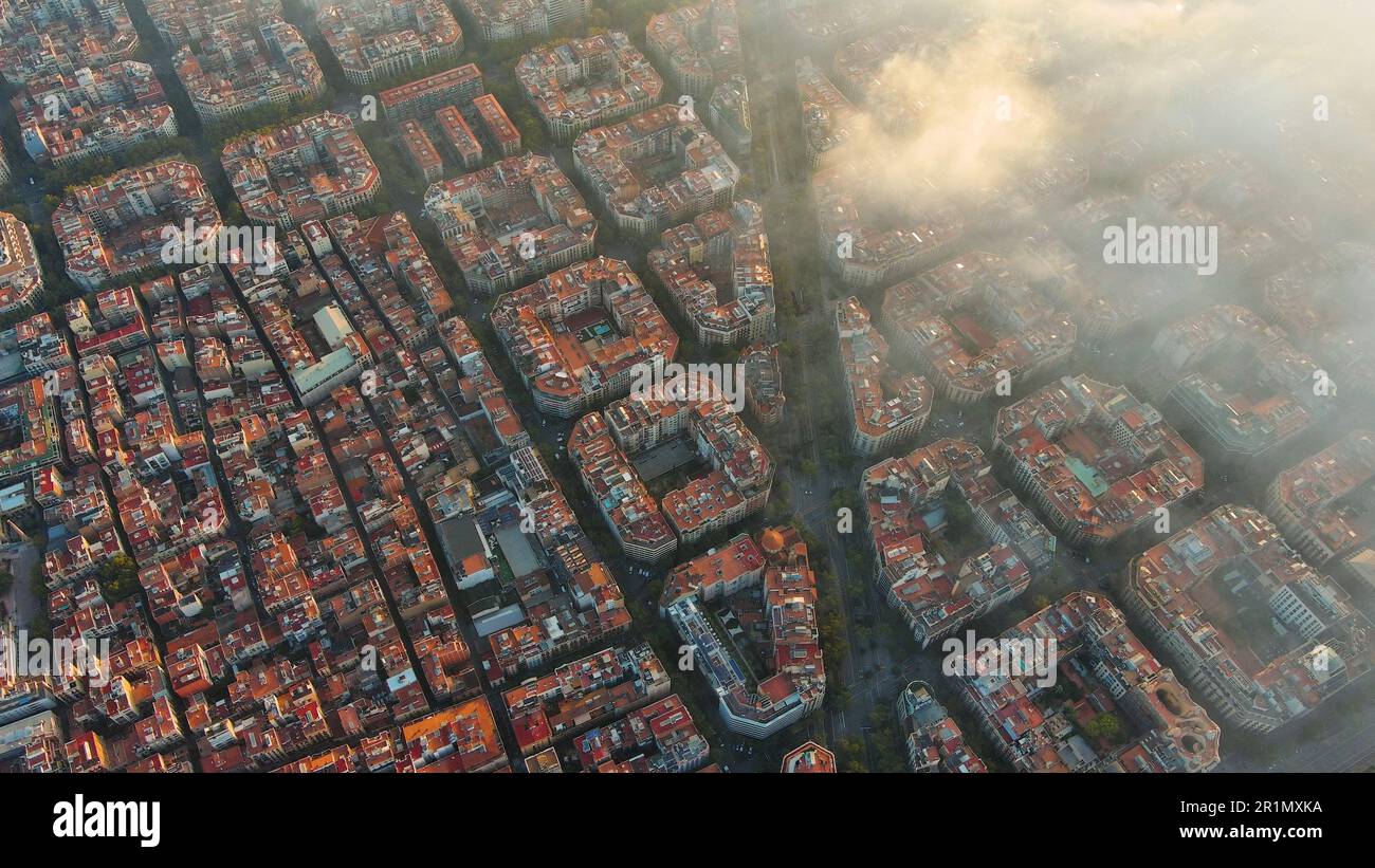 Barcelona City above the clouds and fog, typical buildings of Barcelona ...
