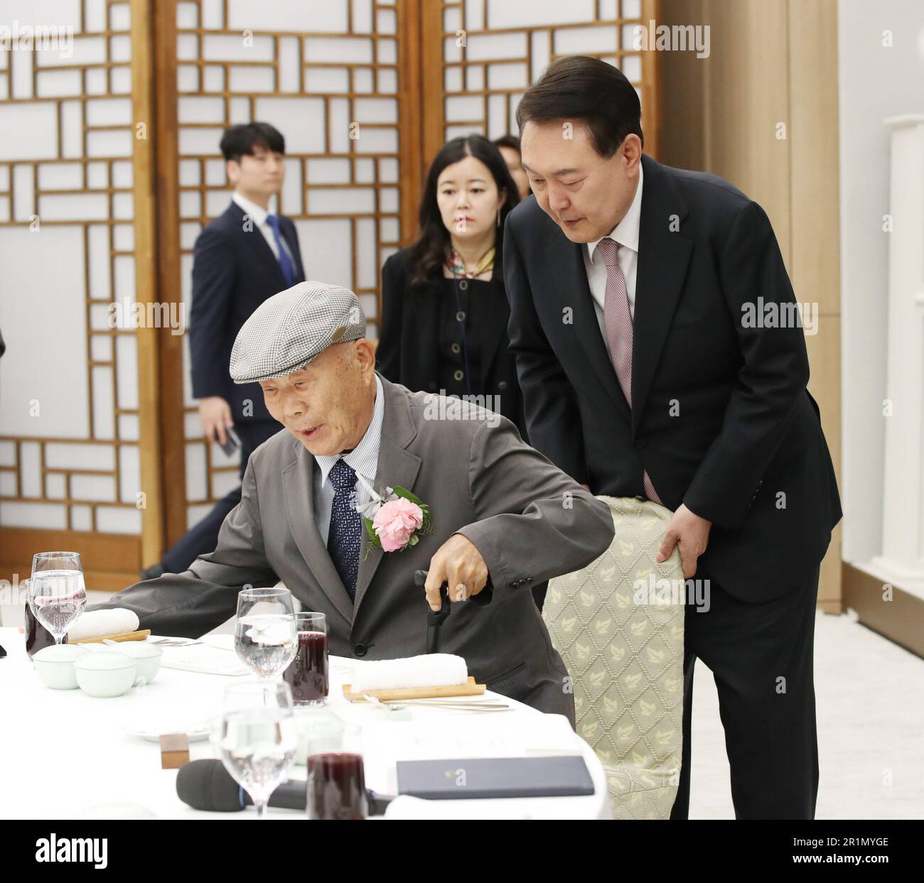 15th May, 2023. Yoon with teachers President Yoon Suk Yeol (R) helps ...