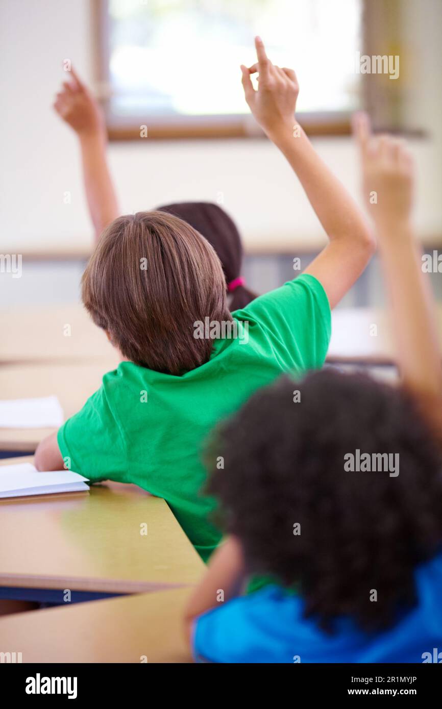Classroom, raise hands and children rear for questions, education and ...