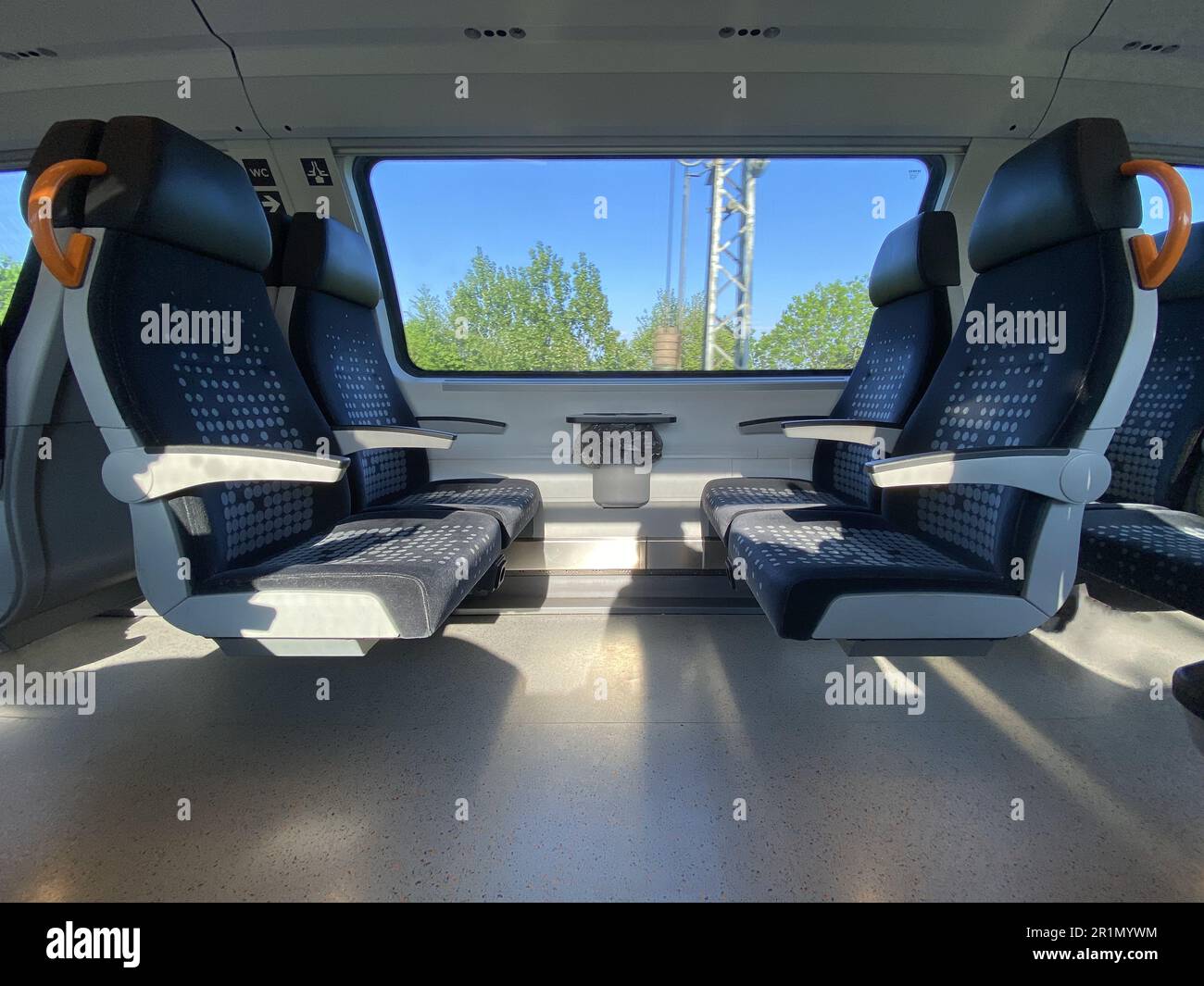 Modern european economy class fast train interior Stock Photo - Alamy