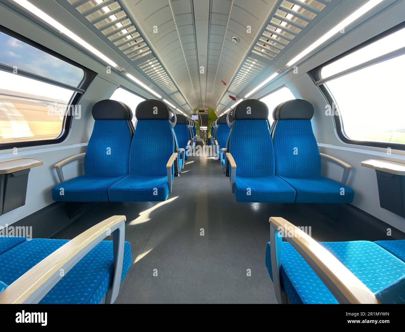 Modern european economy class fast train interior Stock Photo - Alamy