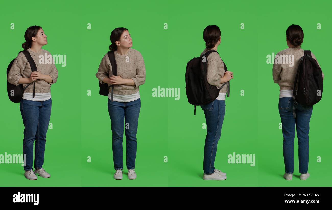 Casual girl carrying backpack and posing on studio background Stock ...