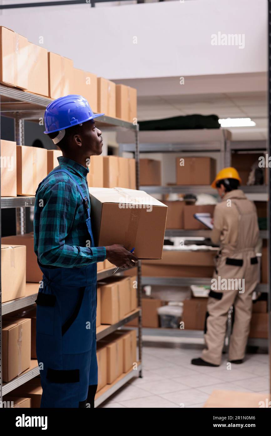 Delivery service worker sorting mail hi-res stock photography and images - Alamy