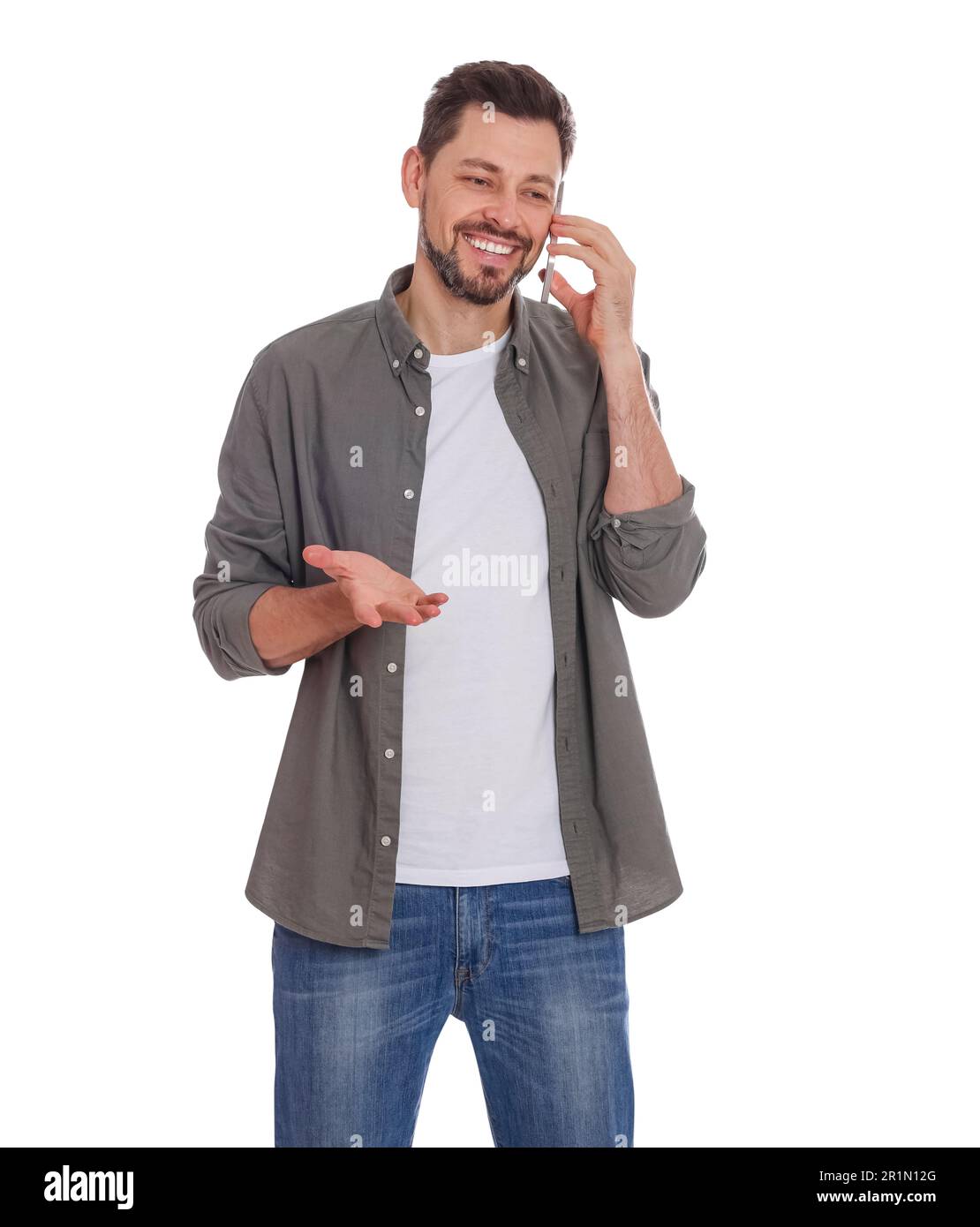 Man talking on phone against white background Stock Photo - Alamy