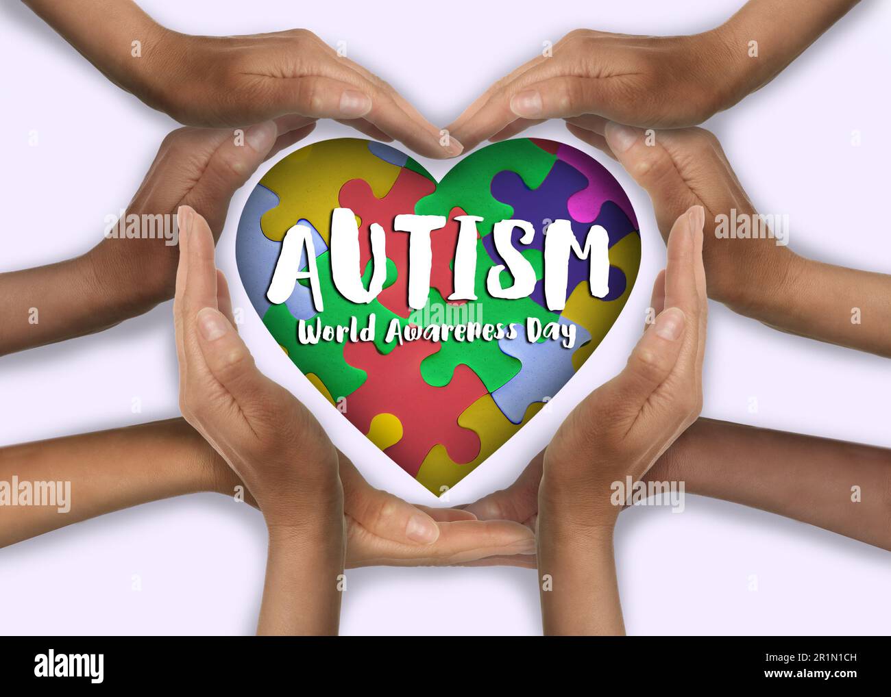 World Autism Awareness Day. People forming heart with their hands on ...