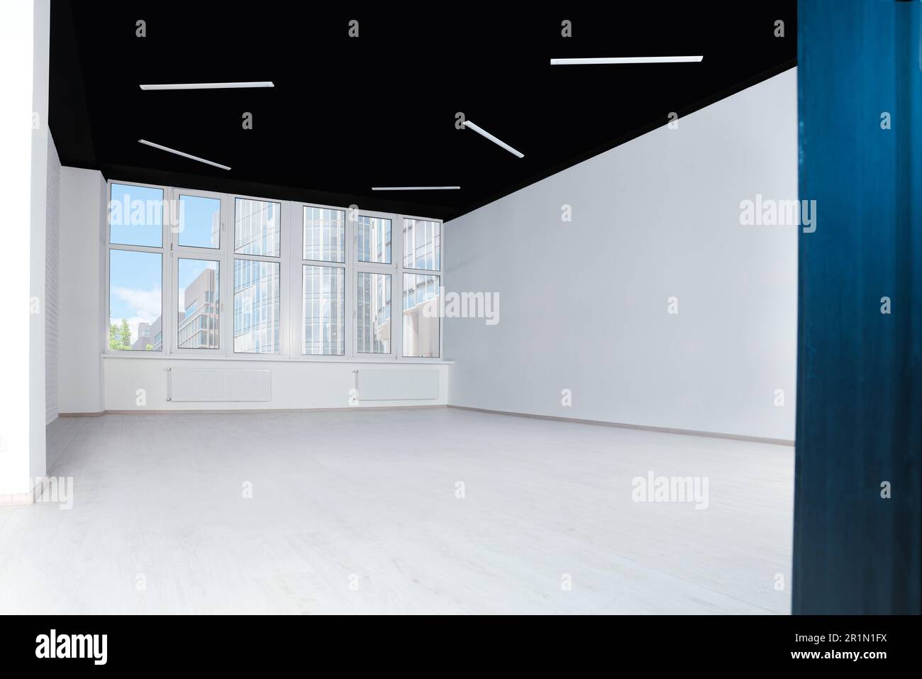 Empty office room with black ceiling and windows. Interior design Stock ...