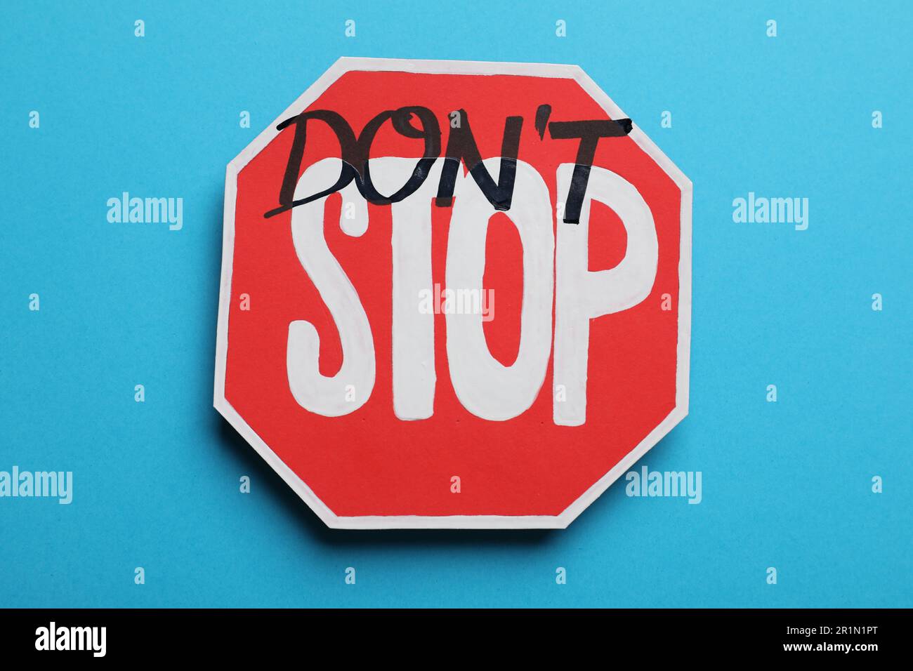 Don't stop - motivational phrase. Road sign sticker with added written ...