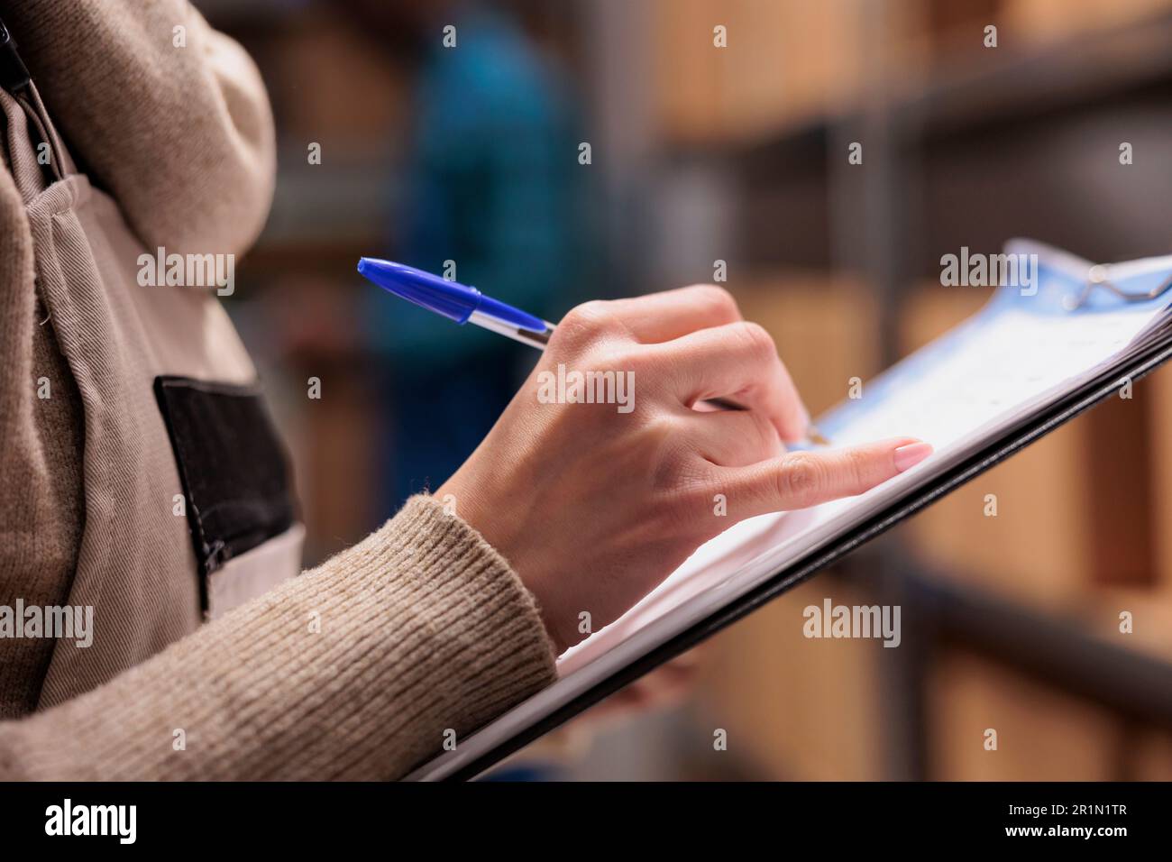 Logistics and distribution department worker managing freight in ...