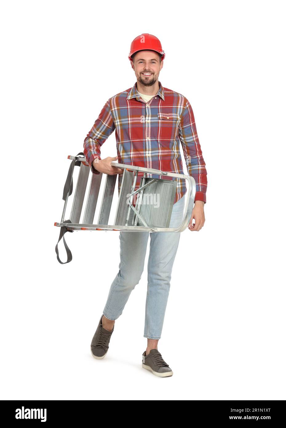 Young handsome man in hard hat holding metal ladder on white background ...