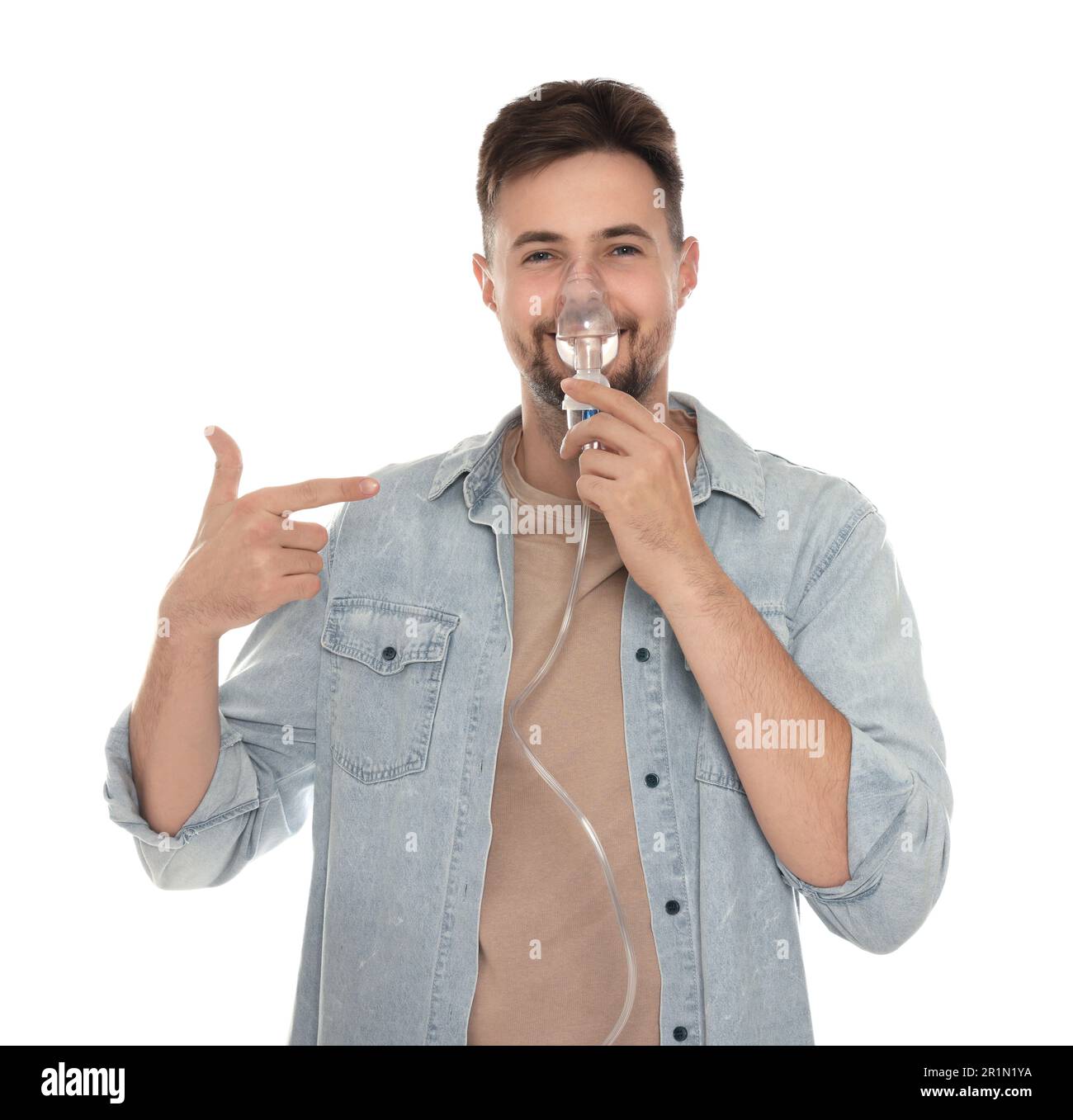 Man using nebulizer for inhalation on white background Stock Photo - Alamy